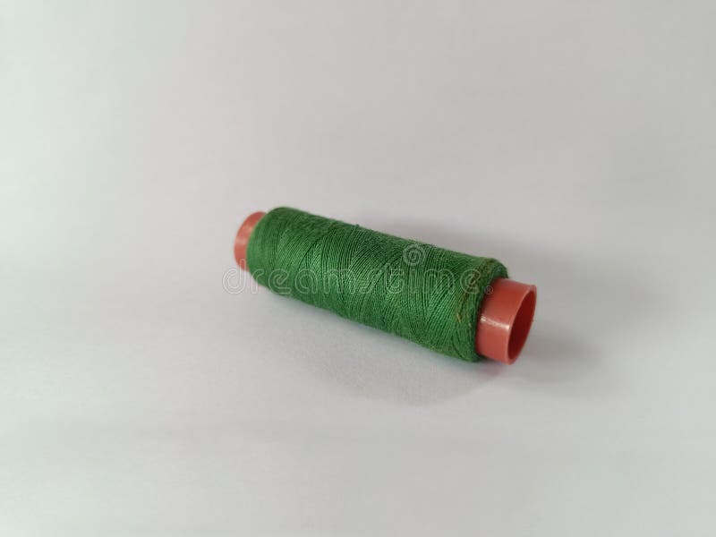 Green Cotton Thread Roll. White Background. Stock Photo - Image of ...