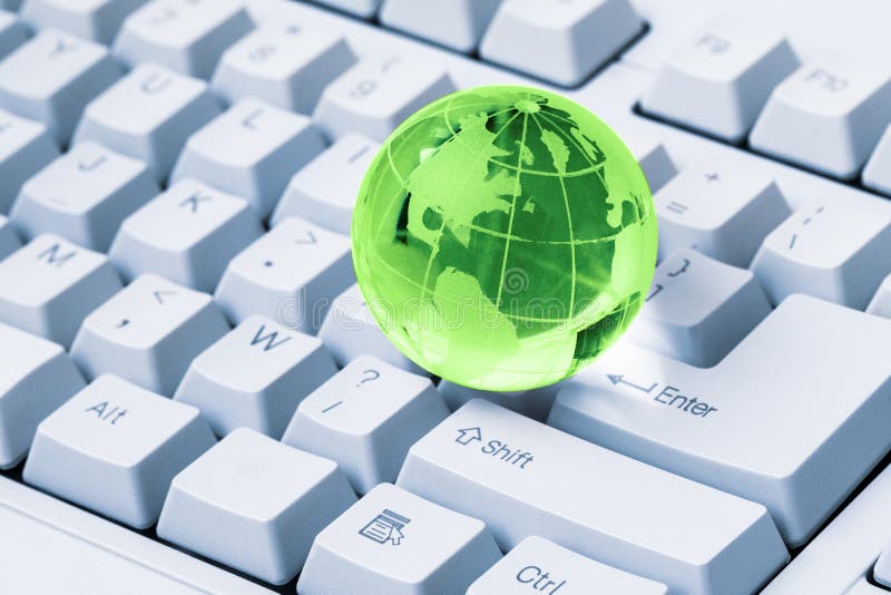 Green Crystal Globe of the Earth on a Computer Keyboard Stock Photo ...