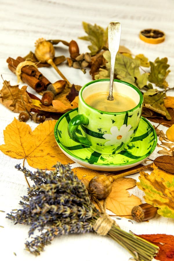 Green Cup of Coffee and Autumn Leaves. Autumn Fall Background with ...