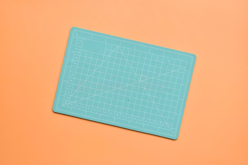 Green Cutting Mat on Orange Background, Object Tool for Design Stock ...