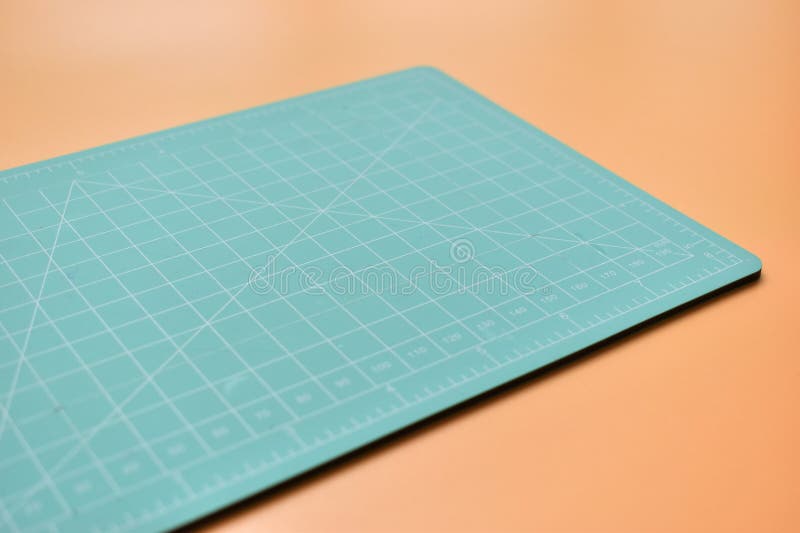 Green Cutting Mat on Orange Background, Object Tool for Design Stock ...