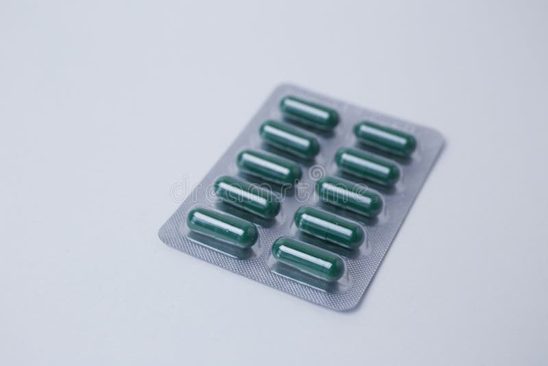 Green drug capsule stock image. Image of pain, chemistry - 86481407