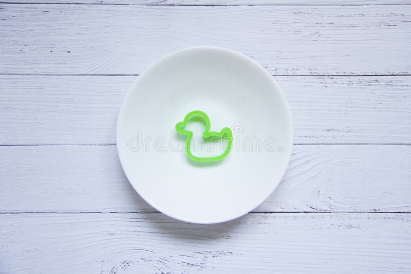 Green Duck Toy Shape on a White Plate. the Form for the Test on a White ...