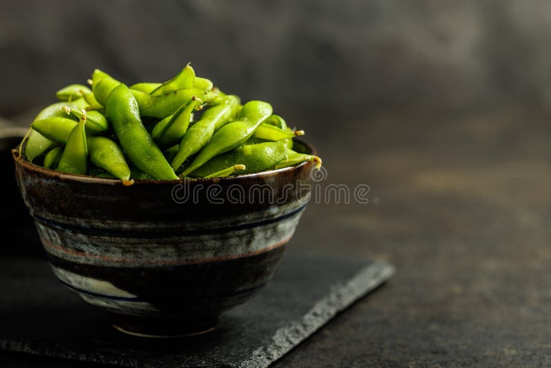 Green Edamame Pods. Fresh Soybeans in Bowl on Black Table Stock Image ...
