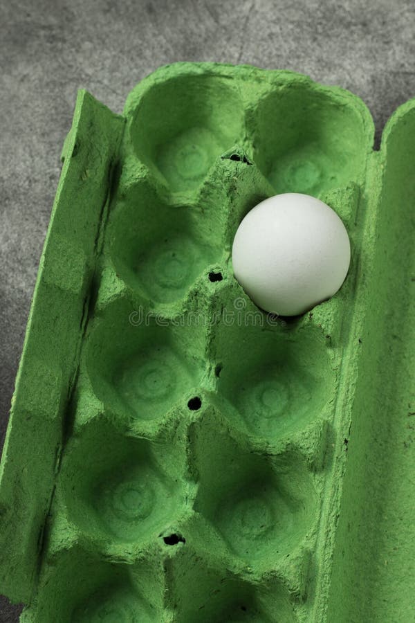 Green Egg Box with One White Egg. Stock Photo - Image of carton ...