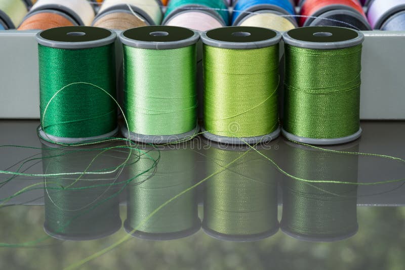 Green Embroidery Thread Reels Stock Photo - Image of white, place: 97603802