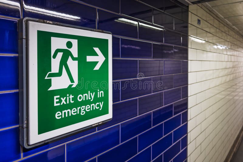 Emergency Exit Sign on Blue Tiled Wall in London Underground Station ...