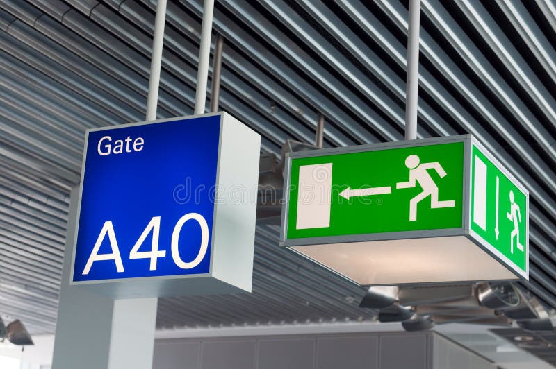 Green Emergency Exit Sign, and Blue Gate Sign Stock Image - Image of ...