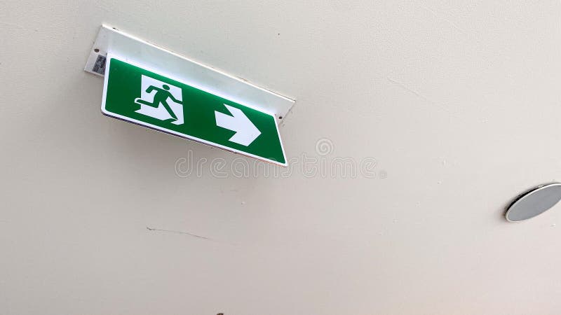 Green Emergency Exit Sign on Ceiling Stock Image - Image of instruction ...