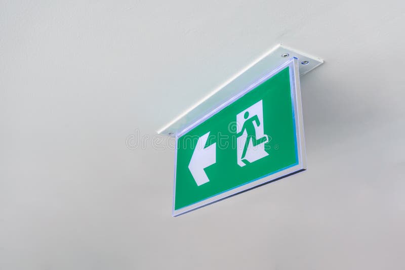 Green emergency exit sign. stock image. Image of hanging - 101296081