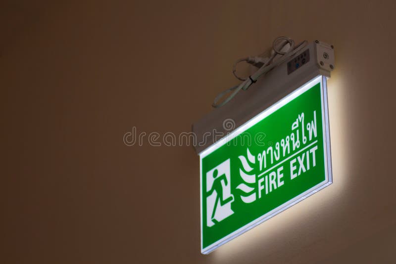 The Green Emergency Exit Sign in Hospital Showing the Way To Escape ...