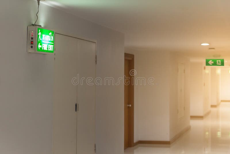 Theâ€‹ Green Emergency Exit Sign in Hotel Showing the Way To Escape ...