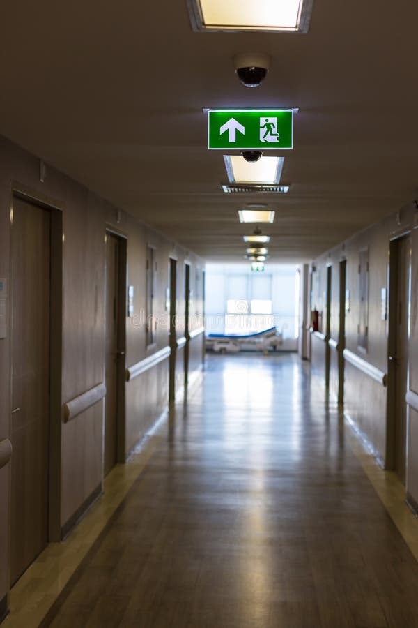 Green Emergency Exit Sign Showing the Way To Escape.Fire Exit in the ...