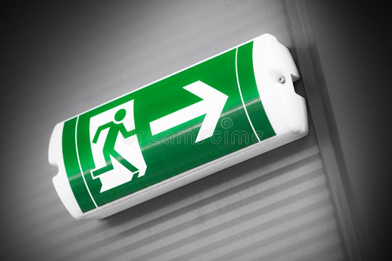 Green Emergency Exit Sign Showing the Way To Escape Stock Image - Image ...