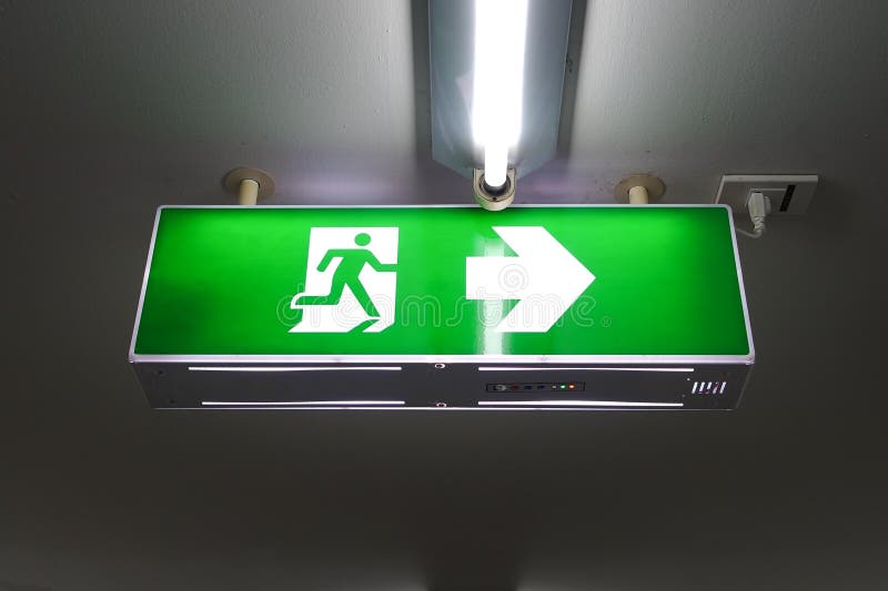 Green emergency exit sign stock photo. Image of lighting - 102527210
