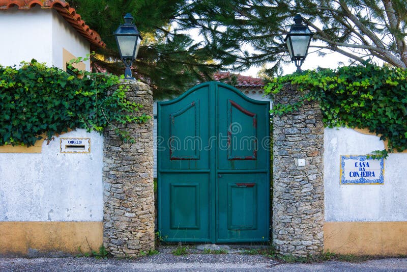 Green entrance gate... stock photo. Image of yellow - 263813070