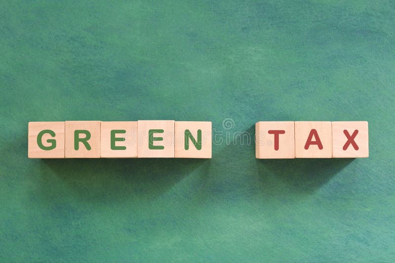 Green and Environmental Tax Concept. Word in Wooden Blocks with ...