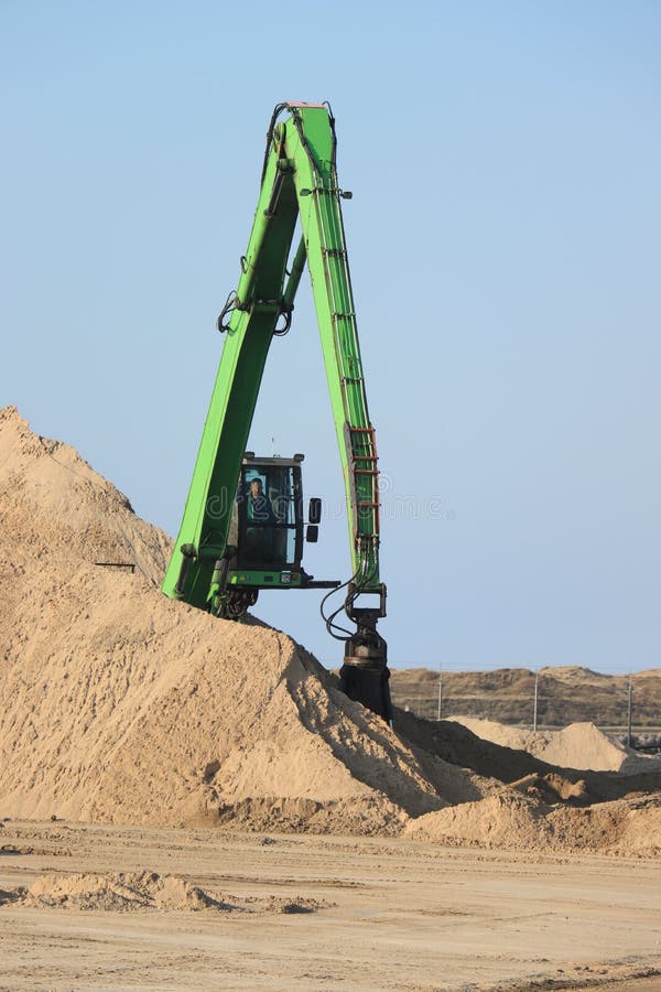 Excavator Scooping and Leaving Tread Marks on Dirt Stock Image - Image ...