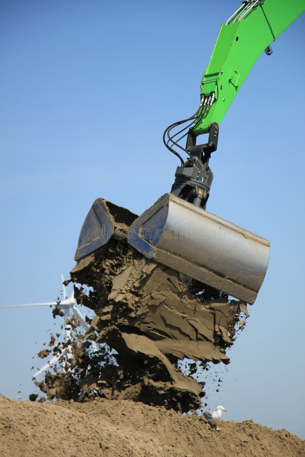 Excavator Scooping and Leaving Tread Marks on Dirt Stock Image - Image ...
