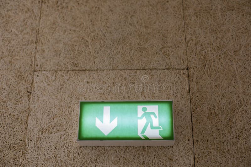 Green Exit Sign Above a Door Stock Image - Image of wall, bright: 161046447