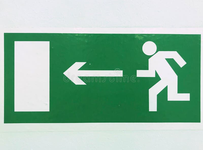 A Green Exit Sign Featuring a Running Man and a Left Arrow Stock Image ...