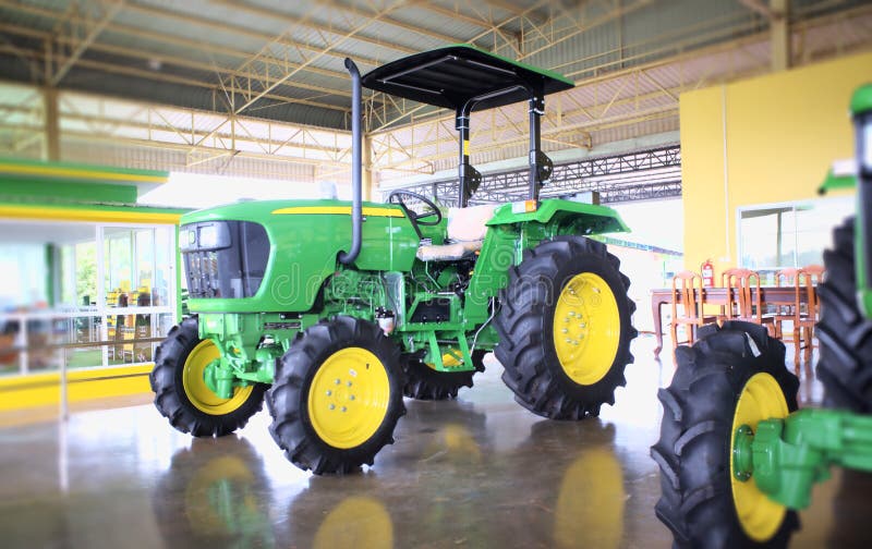 Green Farm Tractor in the Sales Office Stock Photo - Image of farmer ...