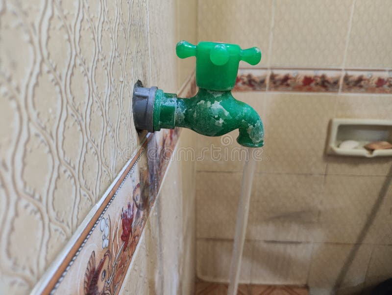 A Green Faucet that Releases Water for Ablution. Stock Image - Image of ...