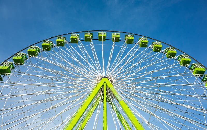 Green Ferris Wheel stock photo. Image of funfair, vacation - 68122486
