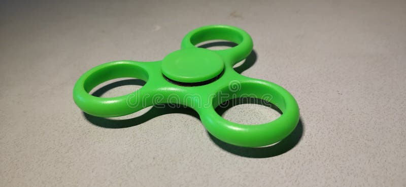 Green Fidget spinner stock photo. Image of memorable - 222480120