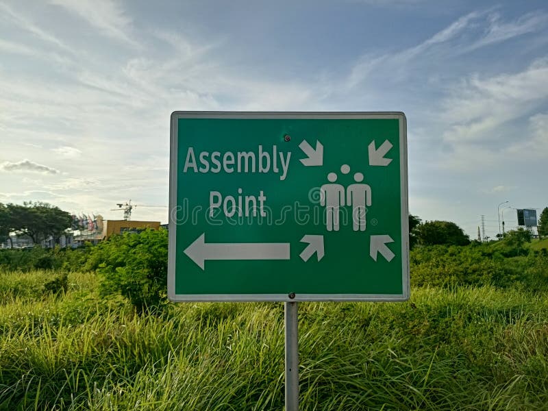 Green Fire Assembly Point Sign Board Stock Image - Image of park, urban ...