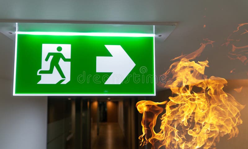 Green Fire Escape Sign Hang on the Ceiling in the Office Stock Image ...