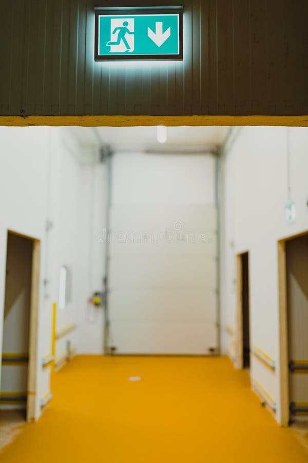 Fire Escape Sign Hang on the Ceiling in the Warehouse Stock Image ...