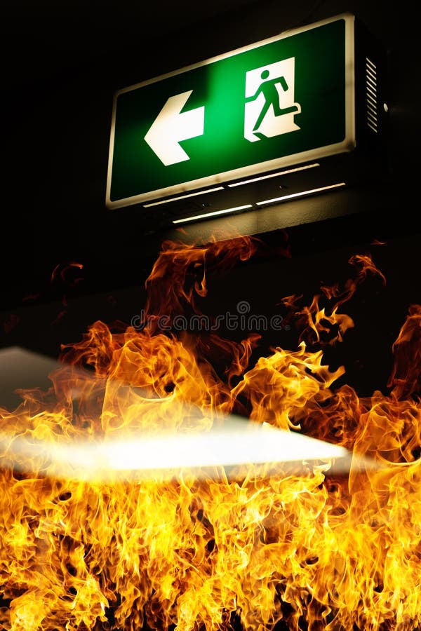 Green Fire Escape Sign Hang on the Ceiling in the Warehouse. the ...