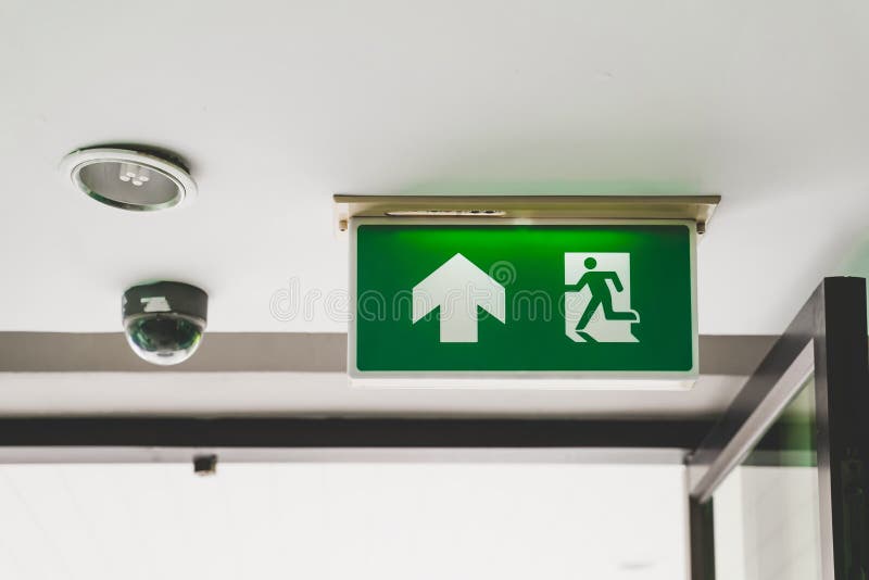 Fire Exit Sign on Ceiling with Opened Door for Emergency Case Stock ...