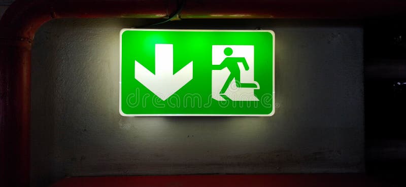 Green Fire Exit Sign in Dark Place Stock Image - Image of icon ...