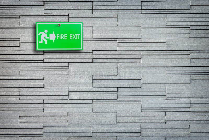 Green Fire Exit Sign on Stone Wall Stock Image - Image of safety ...