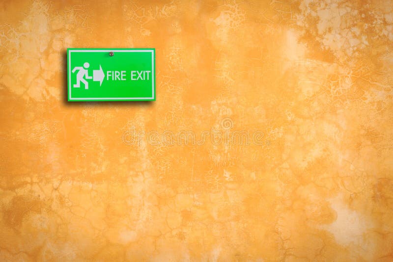 Green Fire Exit Sign on Stone Wall Stock Image - Image of light ...