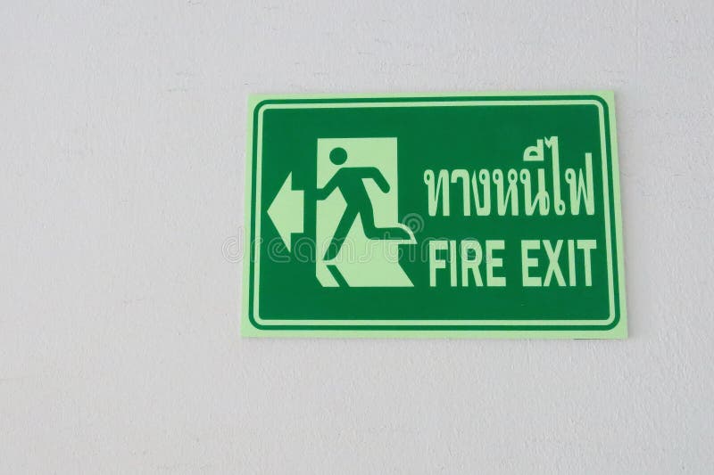 Fire exit sign on the wall stock image. Image of emergency - 123035235