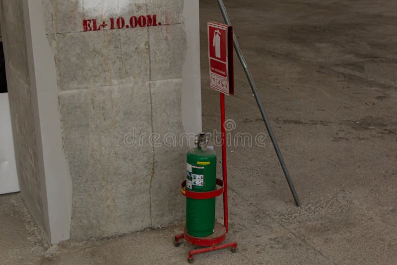 Green Fire Extinguisher and Symbol of Fire Protection Stock Photo ...