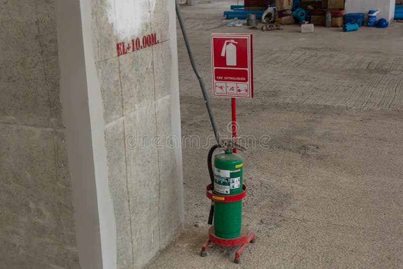 Green Fire Extinguisher and Symbol of Fire Protection Stock Photo ...