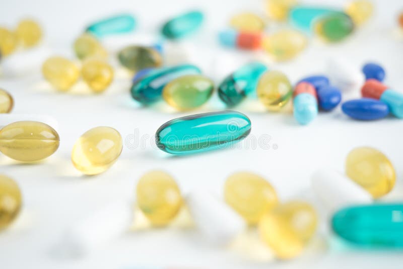 The Green Fish Oil Capsule and Pills, Selective Focus Stock Photo ...