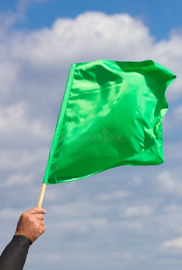 Green Flag Waving on the Sky. Stock Image - Image of clouds, exhibition ...