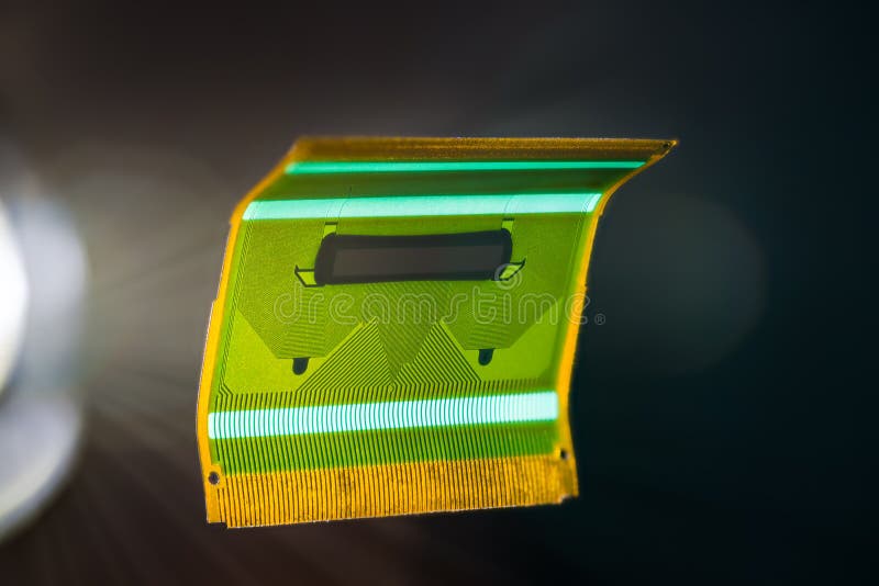 Electronic Flex Circuit Board Detail on Blue Plastic Membrane Curled To ...