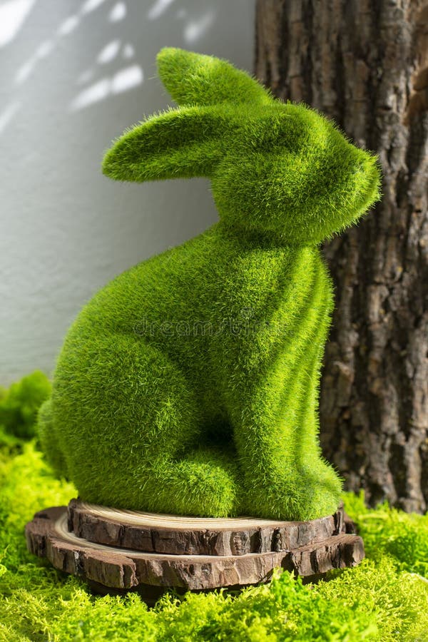 Green Flocked Easter Bunny Decoration on a Tree Slice in the Moss Stock ...