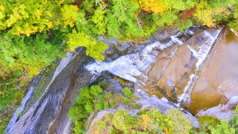 Green Forest from Above with River and Waterfall Dropping Off into Deep ...