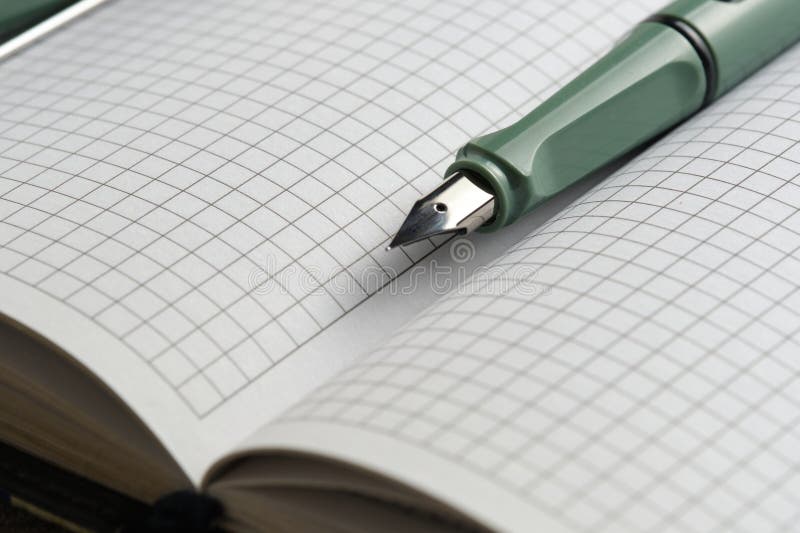 Green Fountain Pen Lies on White Sheets Checkered Notebook. Stock Photo ...