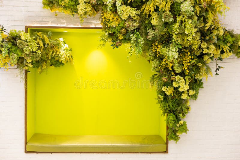 The Green Frame Has a Light Yellow Flower Arch on the White Wall. Use ...