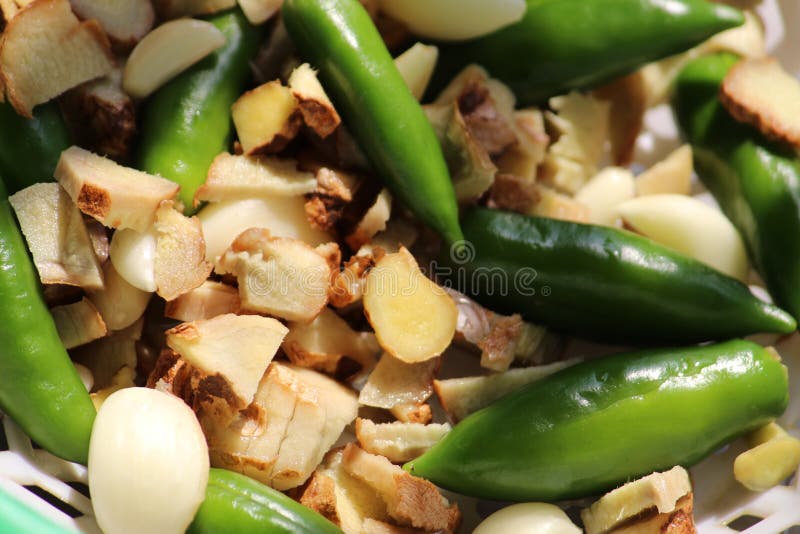 Green Fresh Chilli Display with Raw Ginger Cut Pieces Together with ...