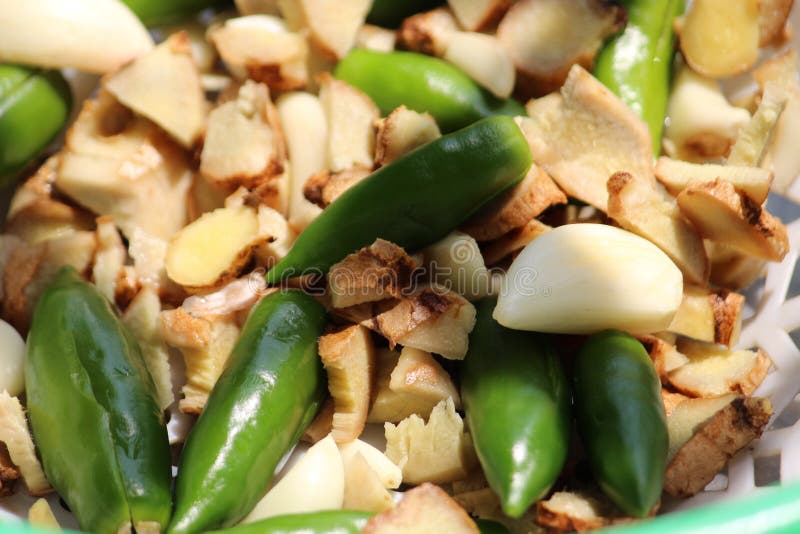 Green Fresh Chilli Display with Raw Ginger Cut Pieces Together with ...