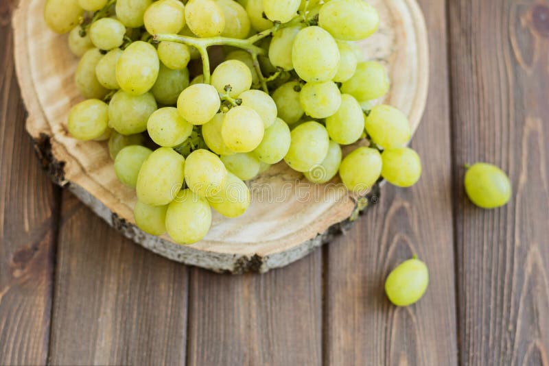 Green Fresh Grapes on Wooden Brown Table Stock Image - Image of purple ...